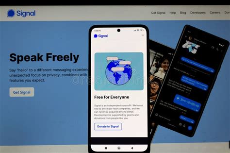 American Open Source Encrypted Messaging Service Signal App On Mobile App In Front Of Desktop