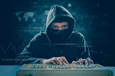 Premium Photo Hacker With Mask Attacking A System