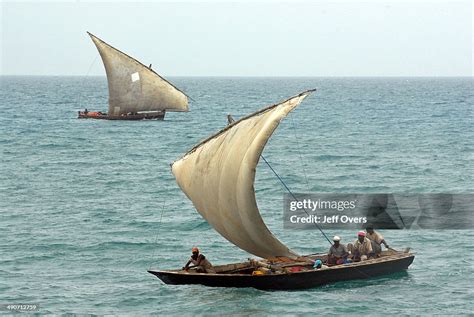 Dhows Sailing Off The Shoreline Of Zanzibar Tanzania A Dhow Is A