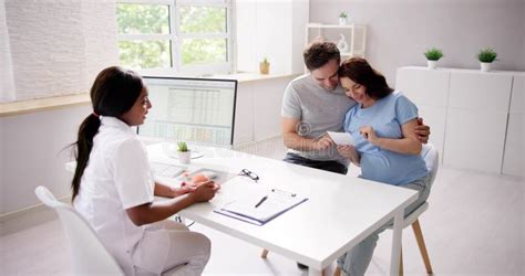 Female Doctor Explaining Ultrasound Scan To Woman Stock Image Image