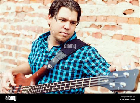 A Street Musician Tuning His Instrument Stock Photo Alamy