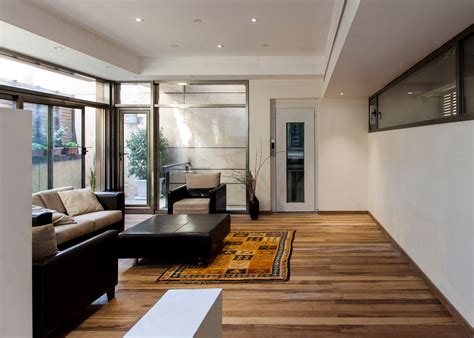 Inward Facing Iranian Home Lets Light Filter In Through A Facade Of Wooden Slats