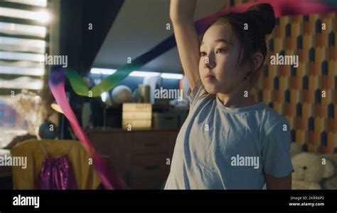 Young Asian Schoolgirl Spins Gymnastic Ribbon Around Herself And Trains New Visual Moves