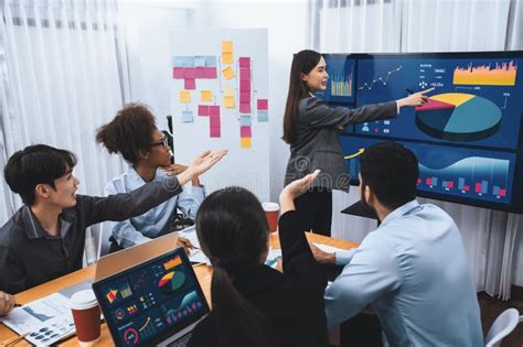 Young Asian Businesswoman Presenting Data Analysis Dashboard On Tv Concord Stock Image Image