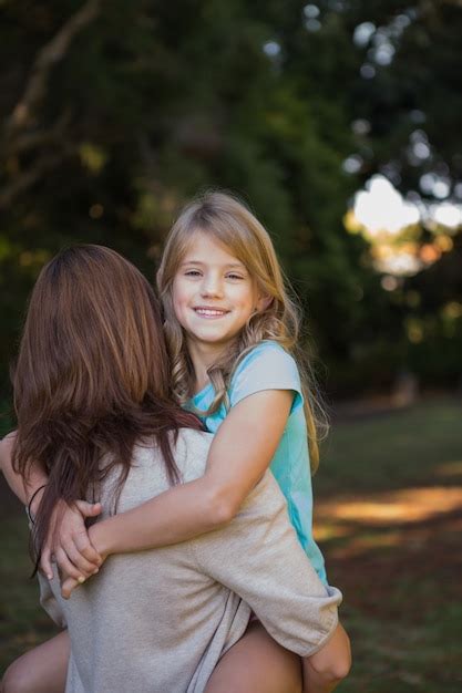 Premium Photo Mother Holding Her Daughter In Arms