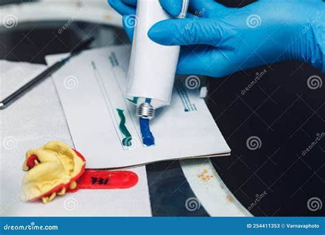 the orthodontist extrudes two component silicone to fill the dental
