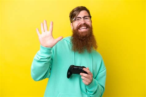 Premium Photo Redhead Man With Beard Playing With A Video Game