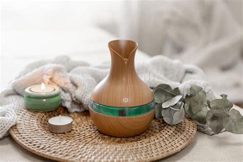 Premium Photo Spa Composition With Aroma Oil Diffuser Lamp On A Blurred Background