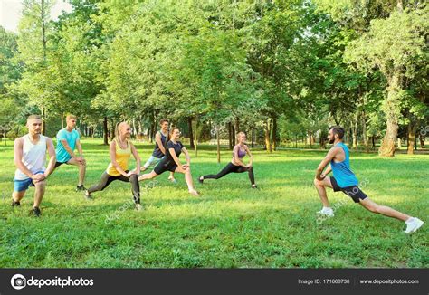 People Exercising In Park