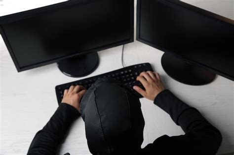 Premium Photo Hacker With Computers In Room