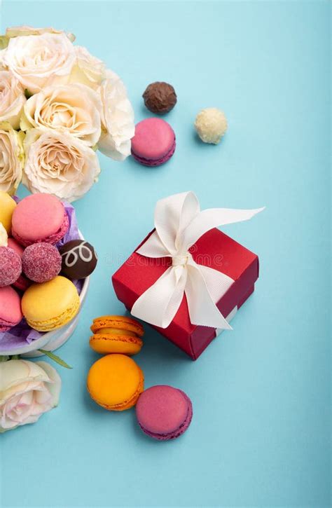 Macaroons T Box Rose Flowers And Chocolate Candies On Blue