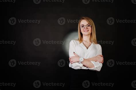 Studio Portrait Of Blonde Businesswoman In Glasses White Blouse And
