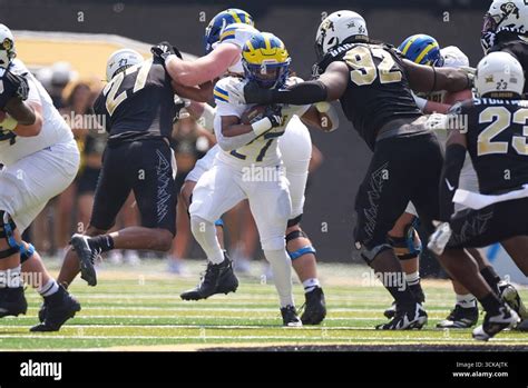 Colorado Defensive Tackle Anquin Barnes Jr 92 Stops Delaware Running Back Jo Silver 27 In
