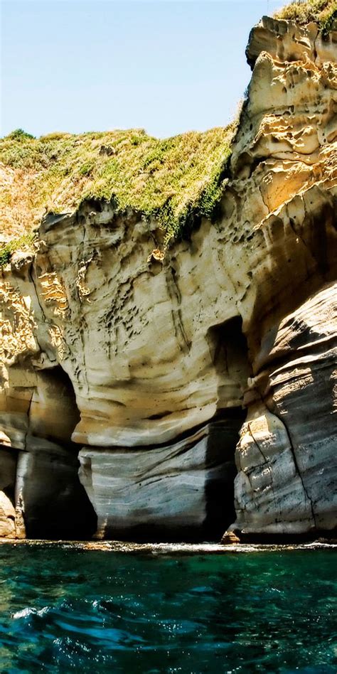 Завантажити шпалери на робочий стіл ПК Скеля Земля Печера Океан Берегова Лінія безкоштовно