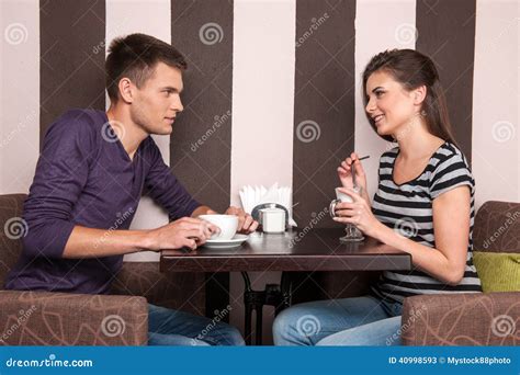 Young Man And Woman Talking In Coffee Shop Stock Image Image Of