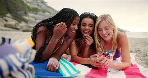 Camera Laughing And Woman Friends On Beach Together For Holiday