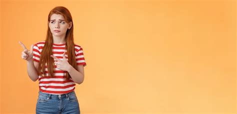 Free Photo Complicated Troubled Cute Young Redhead Girl Puzzled