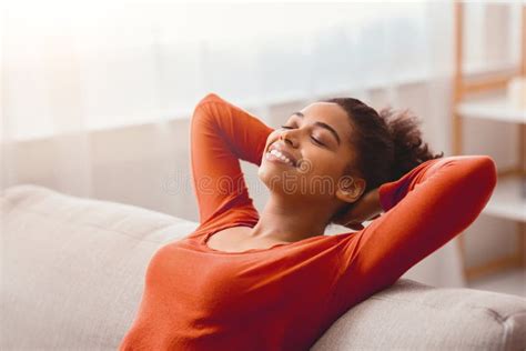Happy Afro Girl Relaxing Sitting On Couch At Home Stock Image Image