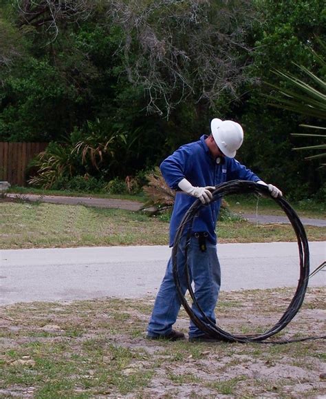 Worker With Cable Near Road Free Stock Photo FreeImages