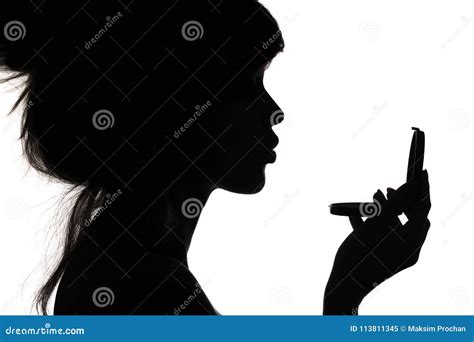 Silhouette Of Woman Admiring Herself In A Mirror Profile Of A Woman