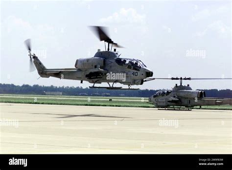 A United States Marine Corps Ah 1w Super Cobra Attack Helicopter Hovers