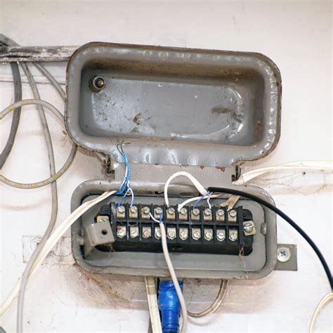 An Old Junction Box With Wires On A Light Wall Stock Image Image Of