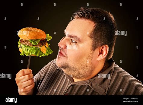 Fat Man Eating Fast Food Hamberger Breakfast For Overweight Person
