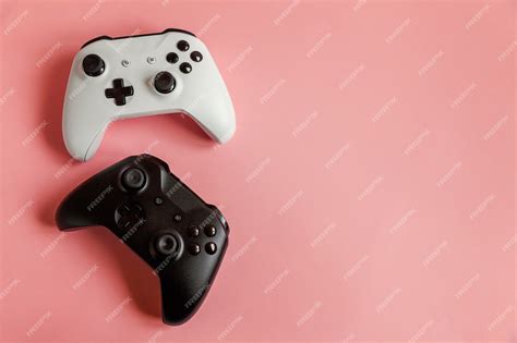 Premium Photo White And Black Two Joystick Gamepad Game Console On