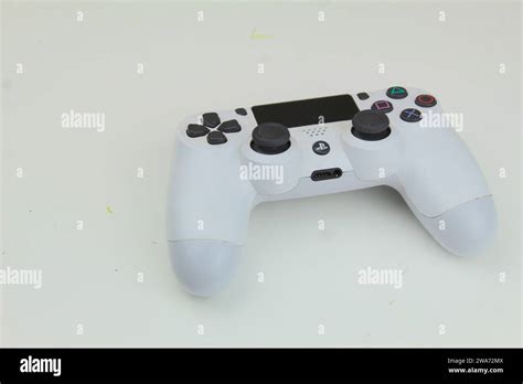 A Close Up Photo Of A White Sony Dualshock 4 V2 Playsation 4 Controller