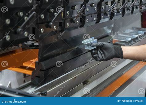 Operation Of Press Brake Hydraulic Bending Machine With Forming Die By Skill Operator Stock