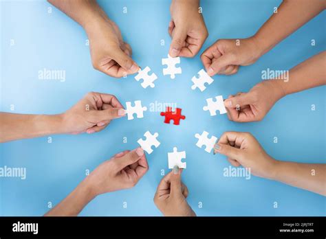 Business Concept Group Of Business People Assembling Jigsaw Puzzle And