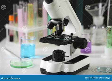 Modern Microscope With Glass Slide On White Table In Laboratory Closeup Stock Photo Image Of