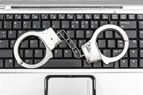 Premium Photo Handcuffs On The Laptop S Keyboard Cyber Crime Concept Top View