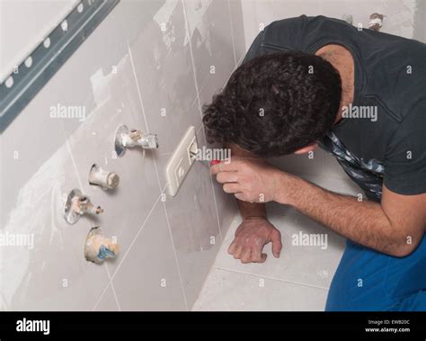 Electrician Repairing A Socket At Home Stock Photo Alamy