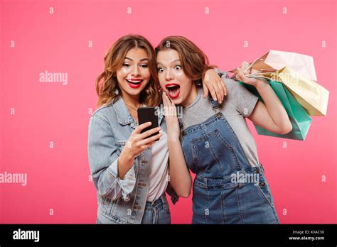 Image Of Shocked Two Women Friends Standing Isolated Over Pink