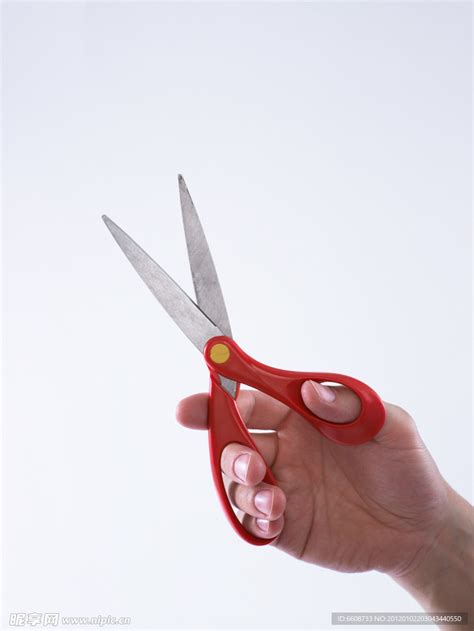 手拿剪刀摄影图 生活素材 生活百科 摄影图库 昵图网