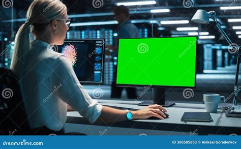 Female Information Technology Specialist And Data Center Administrator Working On Her Computer