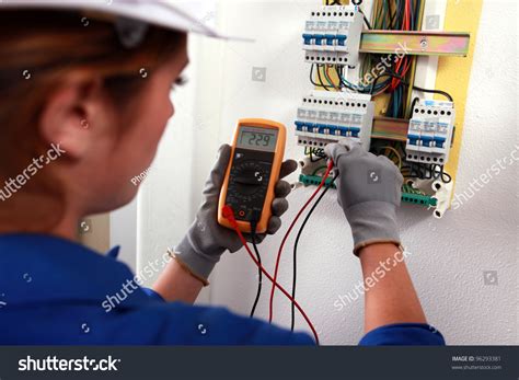 Female Electrician Checking A Fusebox Stock Photo Shutterstock
