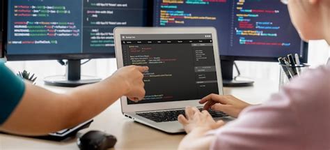 Premium Photo Two Smart Computer Engineers Working Together To Solve