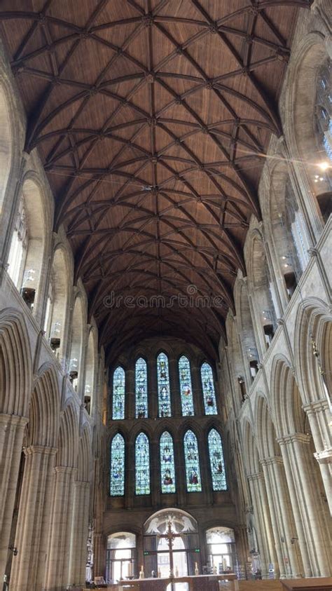 Cathedral Interior With Wooden Ceiling Stone Columns And Stained