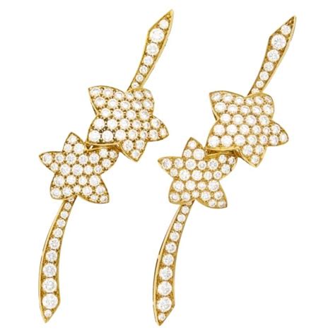 Van Cleef And Arpels Pair Of Gold And Diamond Star Pins For Sale At