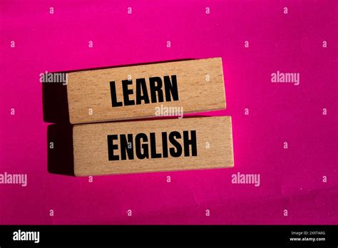 Learn English Message Written On Wooden Blocks With Pink Background