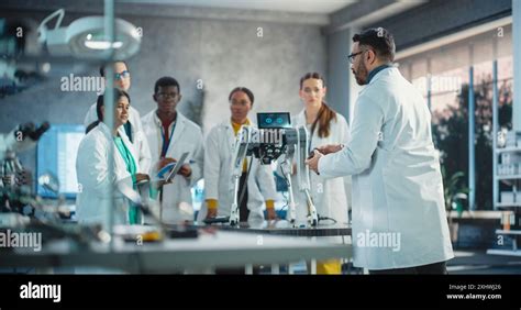 Diverse Team Of Males And Females Discussing Ideas In Technological