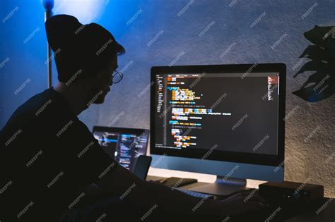 Premium Photo Young Man Mobile Developer Writes Program Code On A