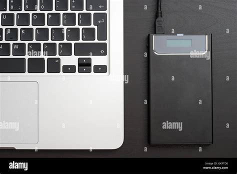 External Hard Disk Over Laptop Keyboard Stock Photo Alamy