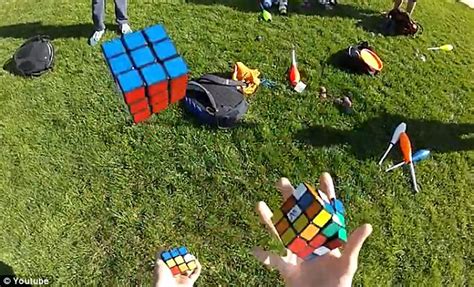 Catch Me If You Can Babe Solves THREE Rubik S Cubes While JUGGLING Them Daily Mail Online