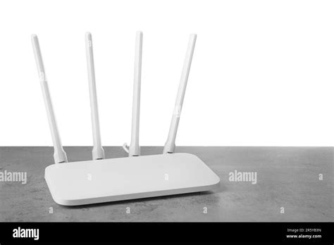 New Modern Wi Fi Router On Grey Table Against White Background Space For Text Stock Photo Alamy