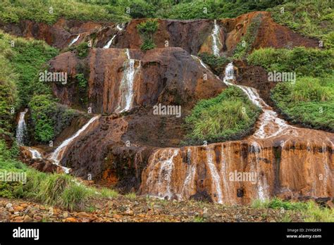 A Small Roadside Waterfall In Juifen Taiwan With Lush Green Grass And