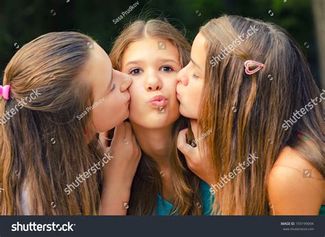 Teens On The Cheek Kiss