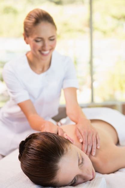 Premium Photo Attractive Woman Receiving Back Massage At Spa Center
